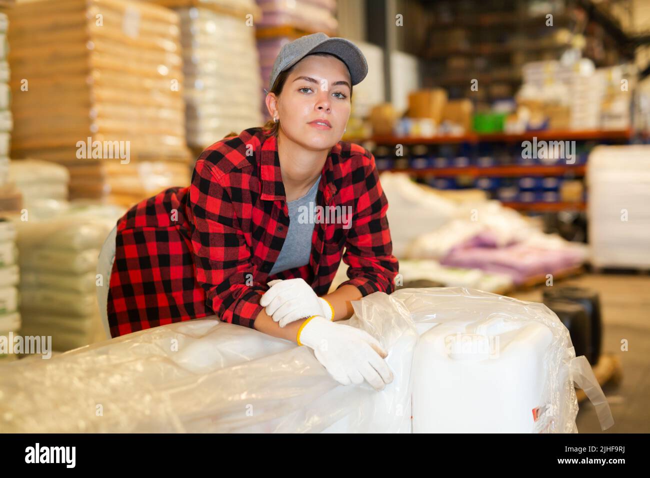 Portrait of female warehouse worker during work break Stock Photo - Alamy
