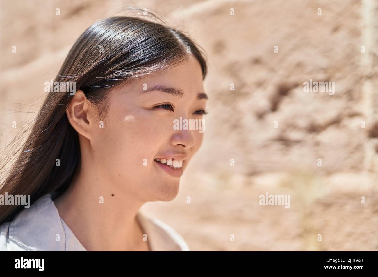 Chinese woman smiling confident looking to the side at street Stock ...