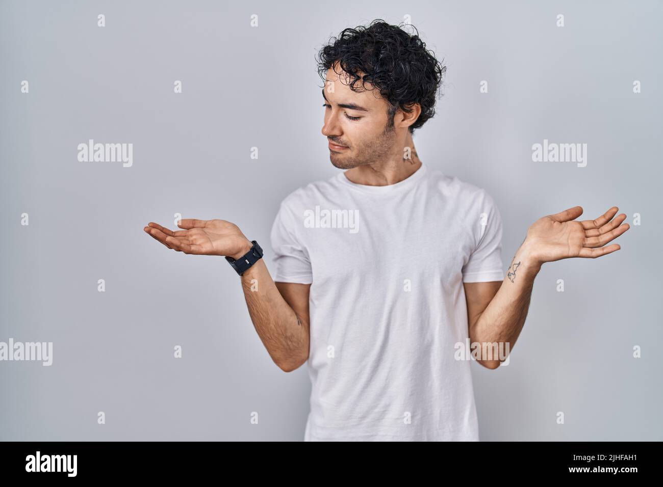 Hispanic man standing over isolated background smiling showing both ...