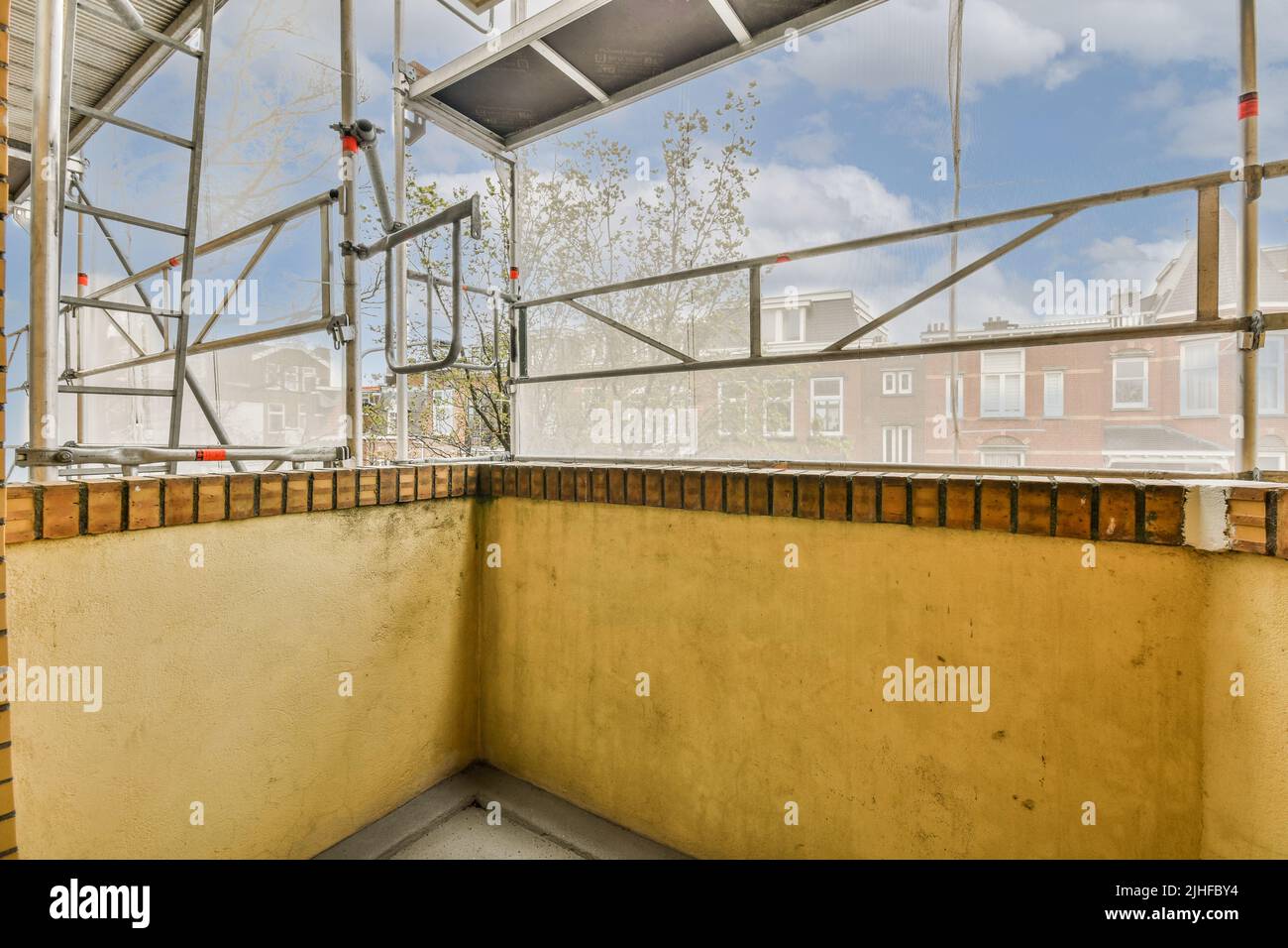 Narrow brick balcony Stock Photo - Alamy