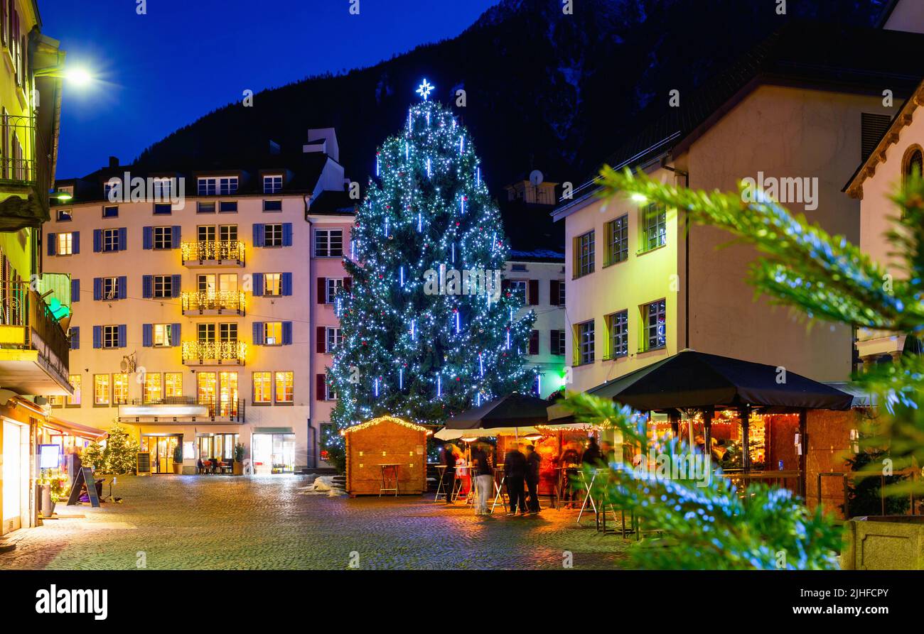 Night view of Brig street with Christmas tree on background of Alps ...