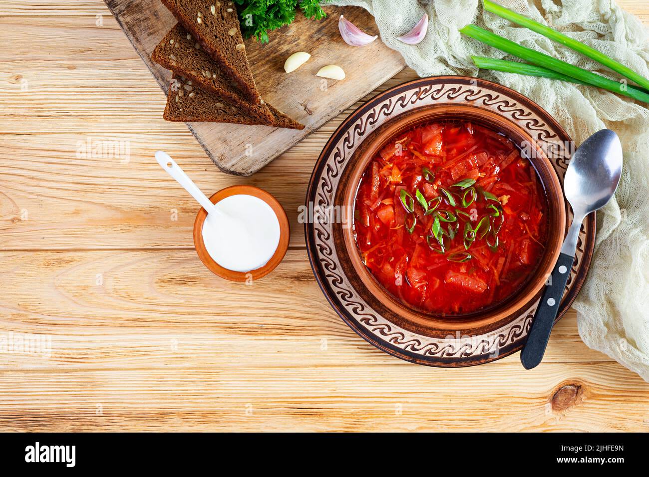 Traditional ukrainian borscht with green onion and sour cream ...