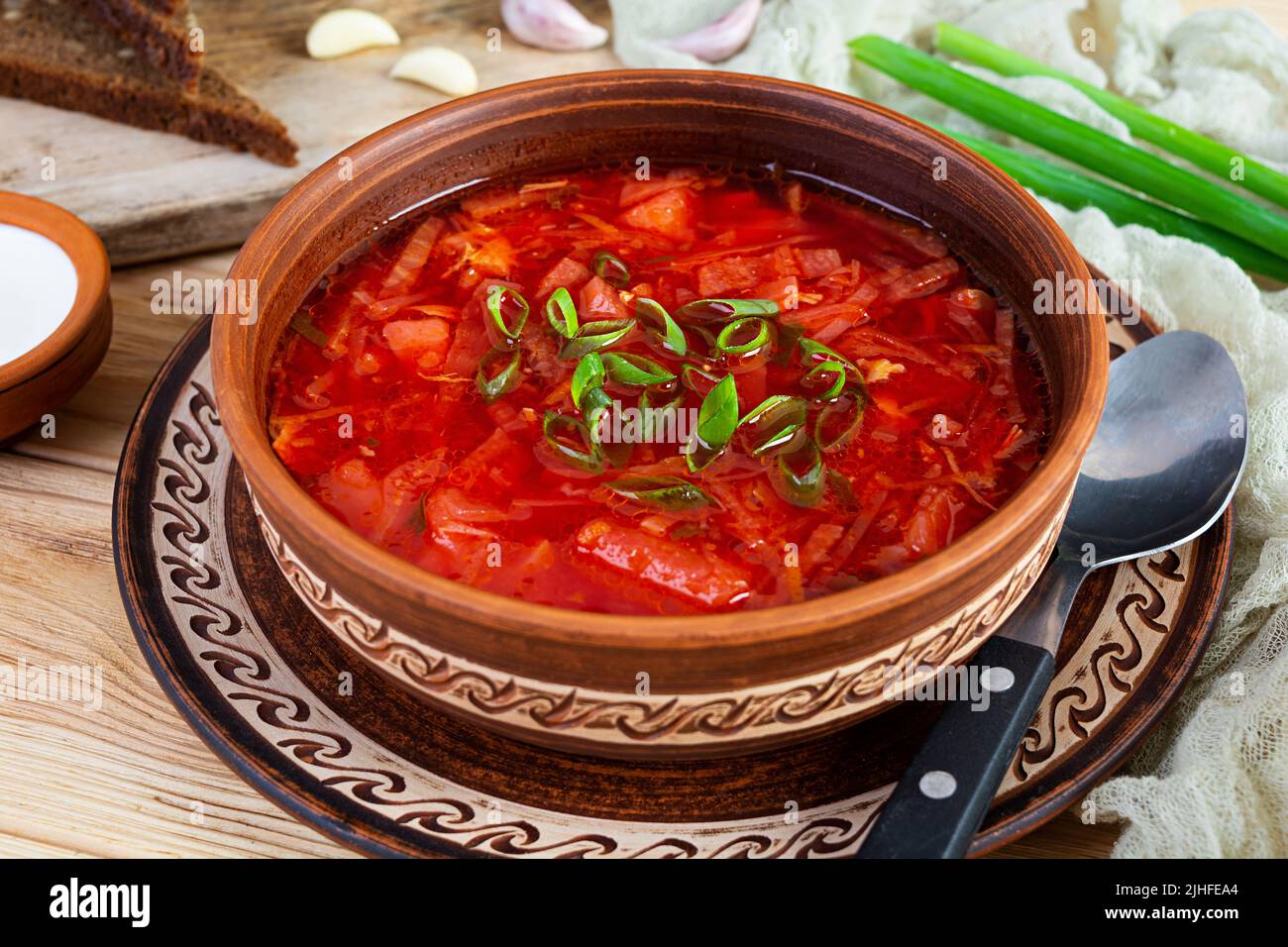 Traditional ukrainian borscht with green onion and sour cream ...