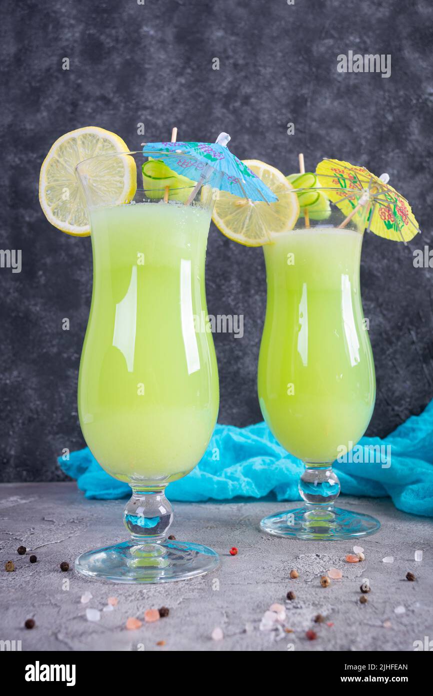 Glass of fresh cucumber juice. Cocktail with cucumber, ice and lemon ...
