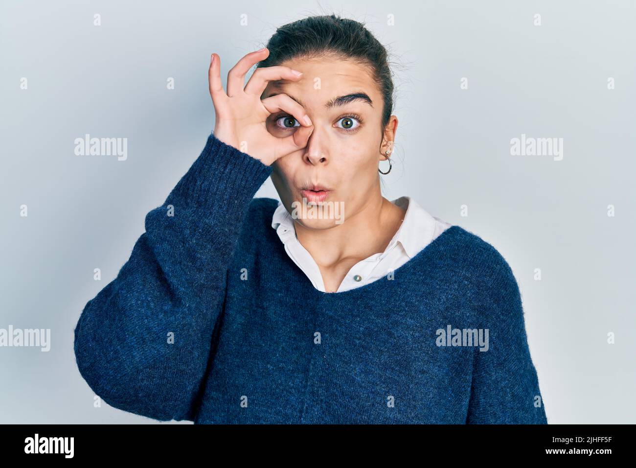 Young caucasian girl wearing casual clothes doing ok gesture shocked ...