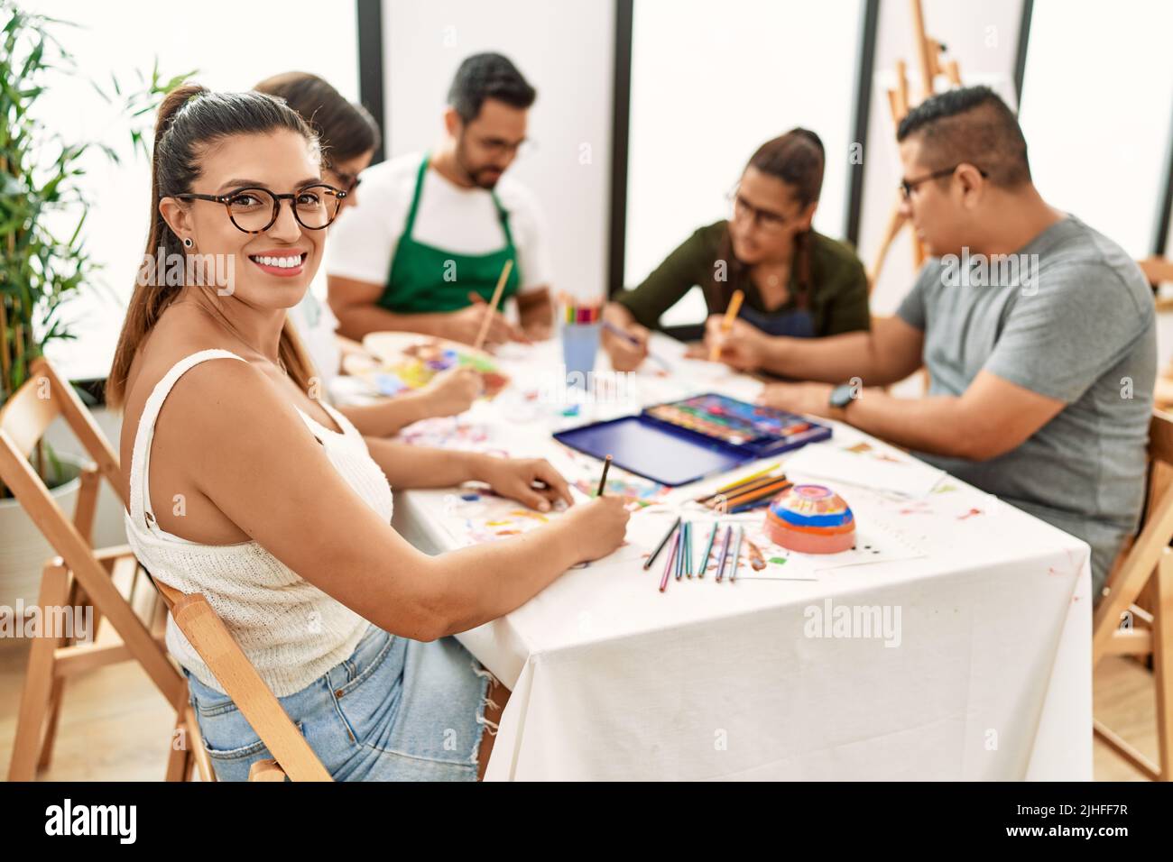 Group of draw students sitting on the table drawing at art studio Stock ...