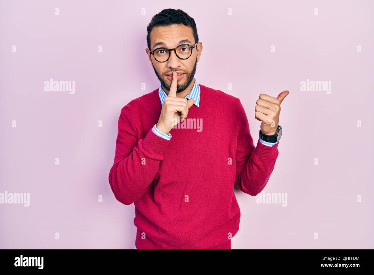 Hispanic man with beard wearing business shirt and glasses asking to be ...