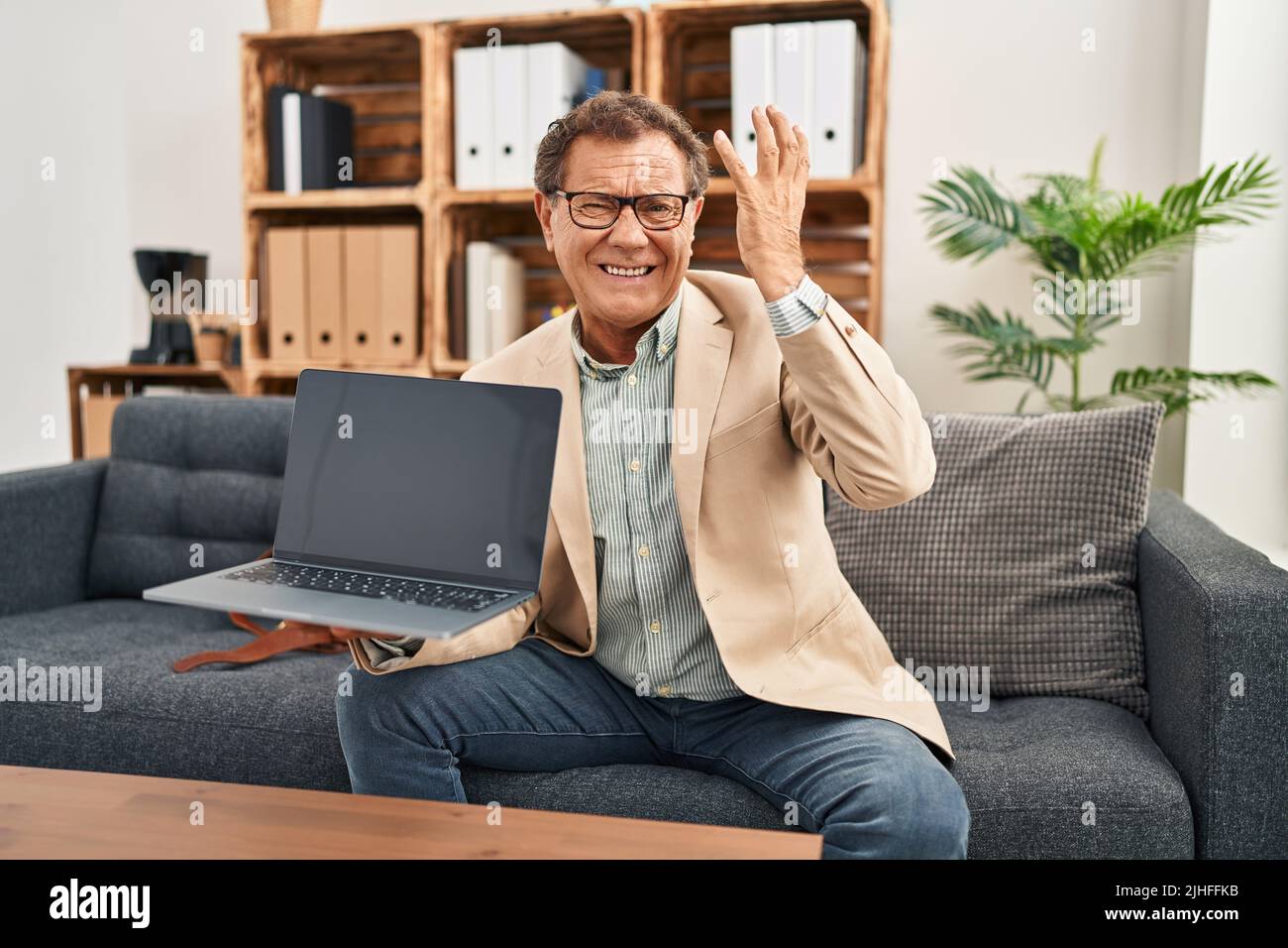Senior psychiatrist man working at consultation office with online ...