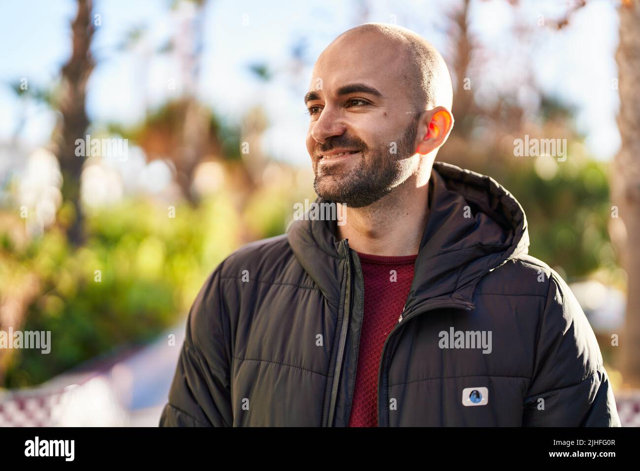 Young man smiling confident standing at park Stock Photo - Alamy