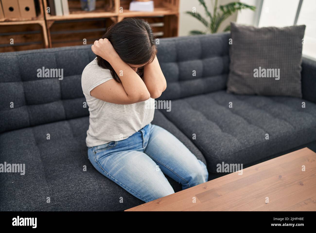 Down syndrome woman patient crying having psychology session at clinic ...