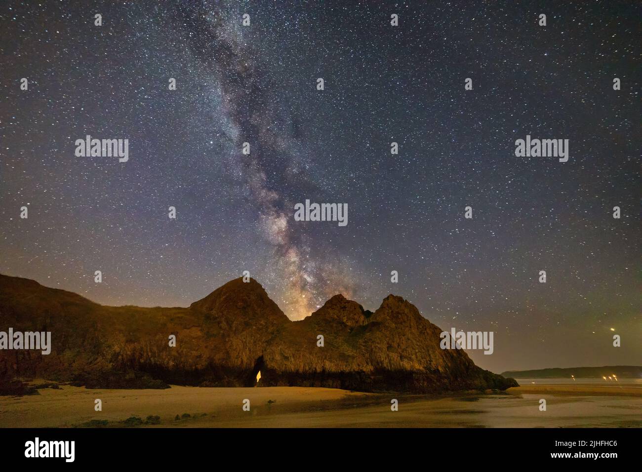 Imposing cliffs stand to the side of this magnificent scene. GOWER ...
