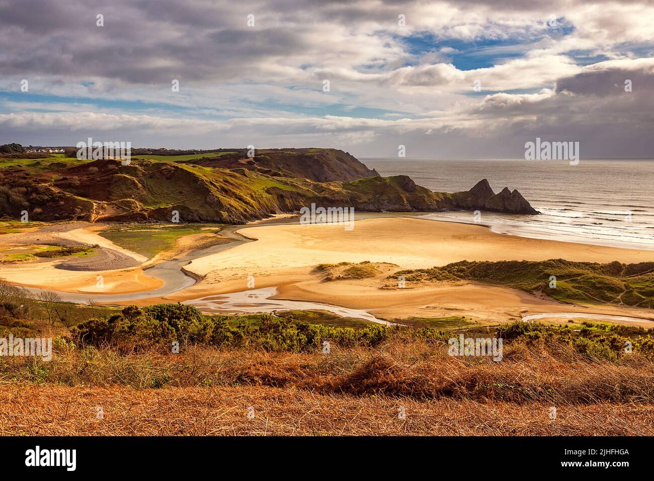 Beautiful golden sand covers Three Cliffs Bay. GOWER, WALES. THIS ...
