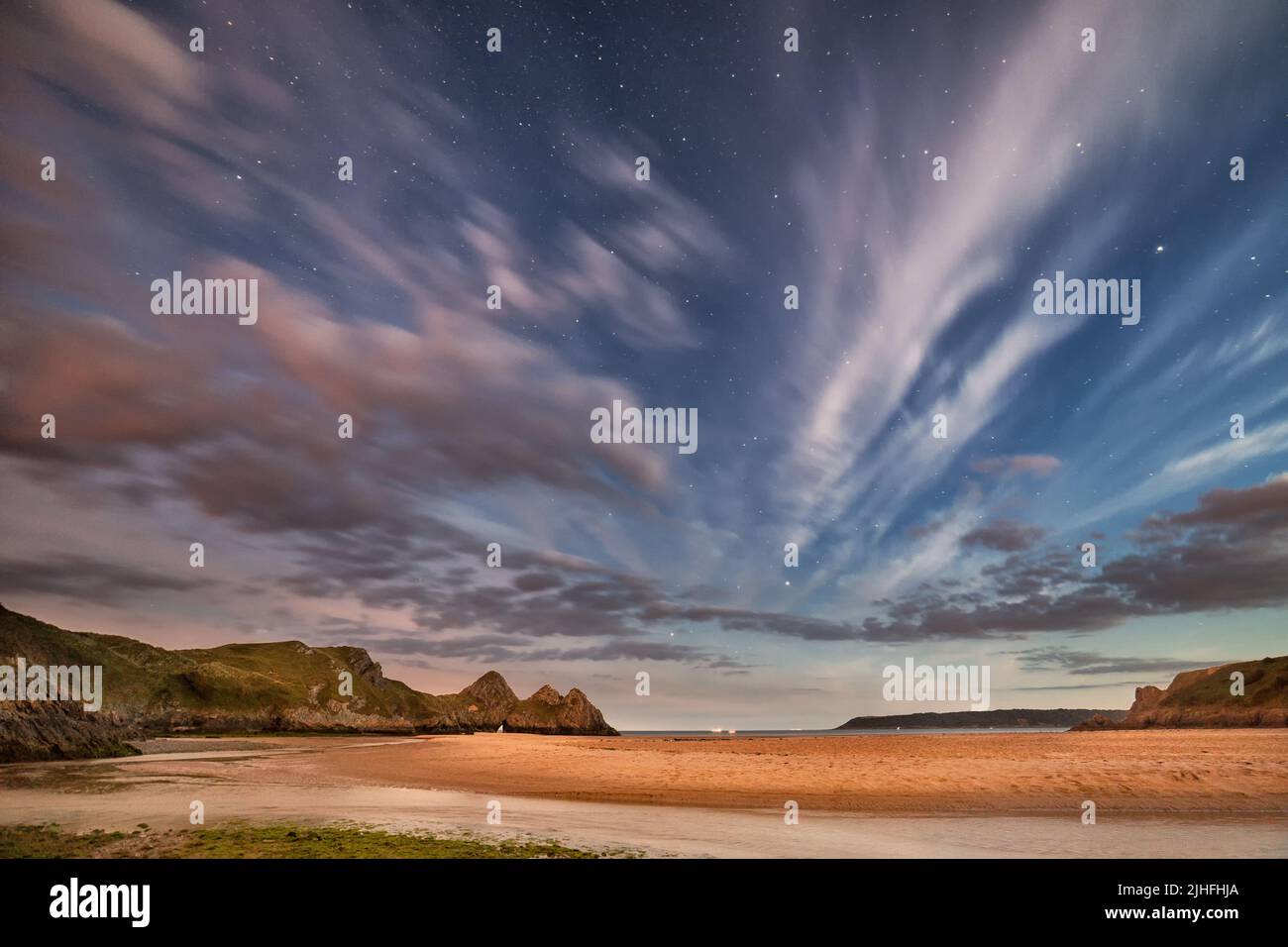 A long-exposure shot showing the clouds in motion. GOWER, WALES. THIS ...