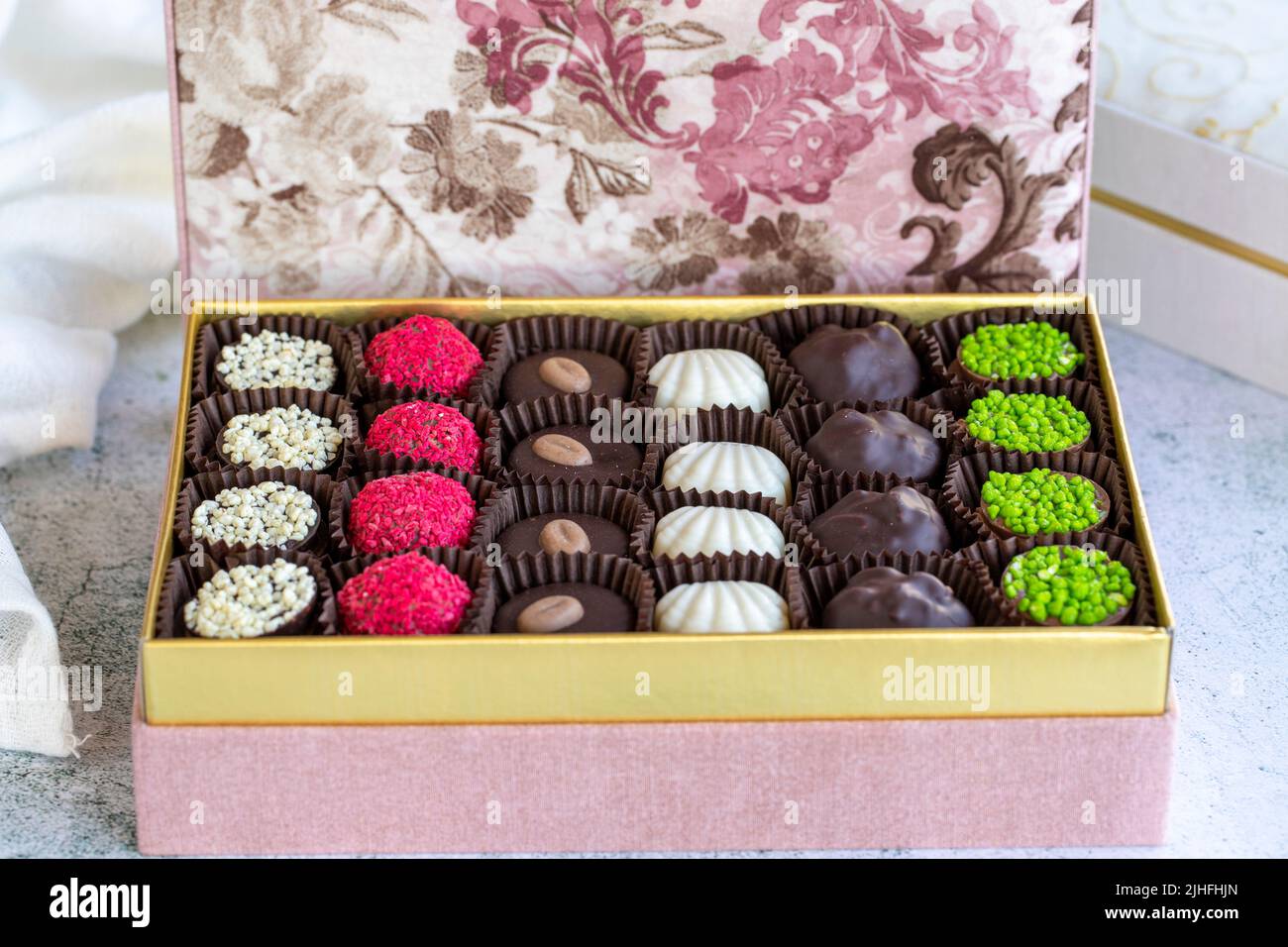 Special chocolate. Packed chocolate on stone background. Truffle ...