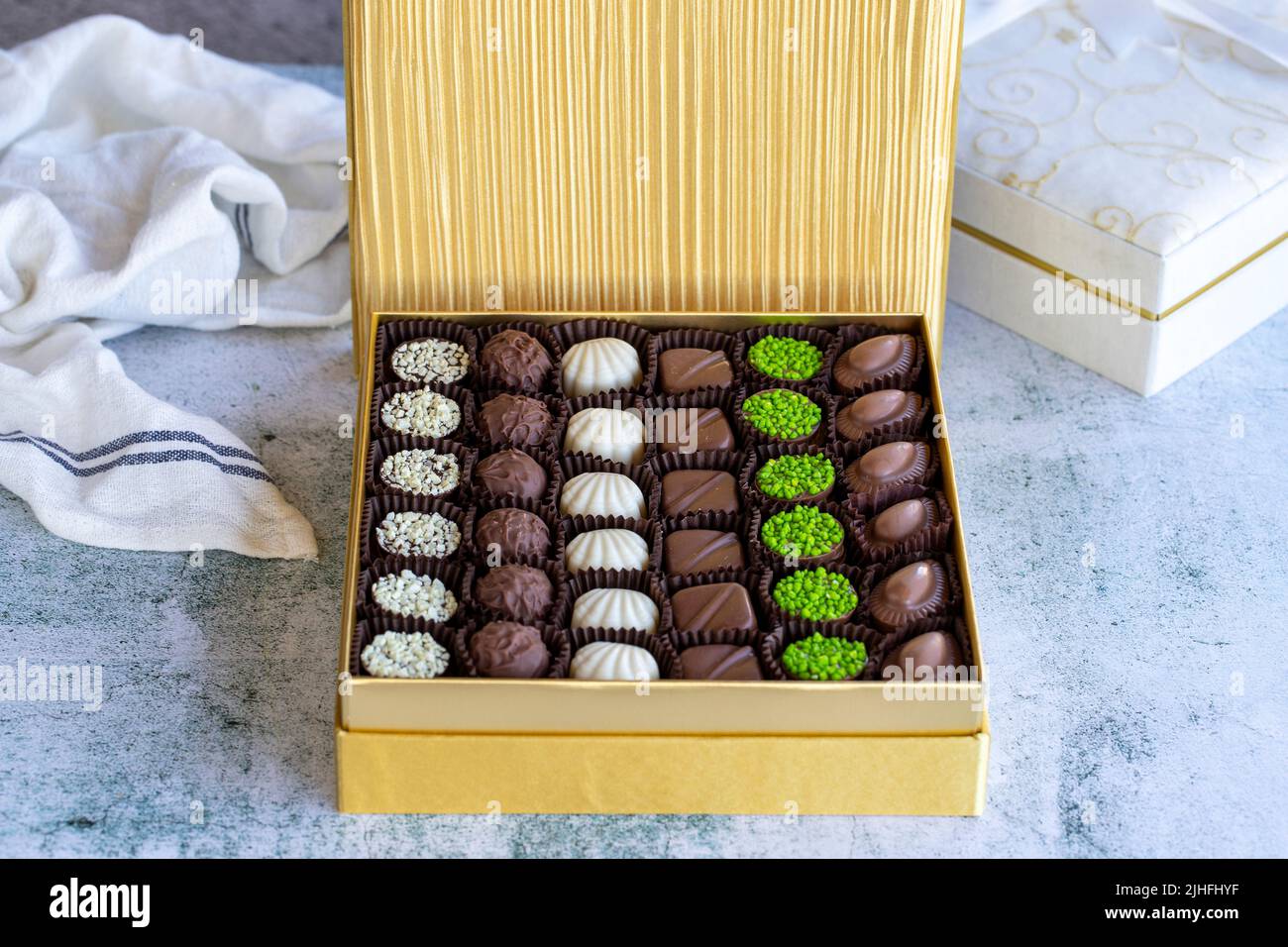 Special chocolate. Packed chocolate on stone background. Truffle ...