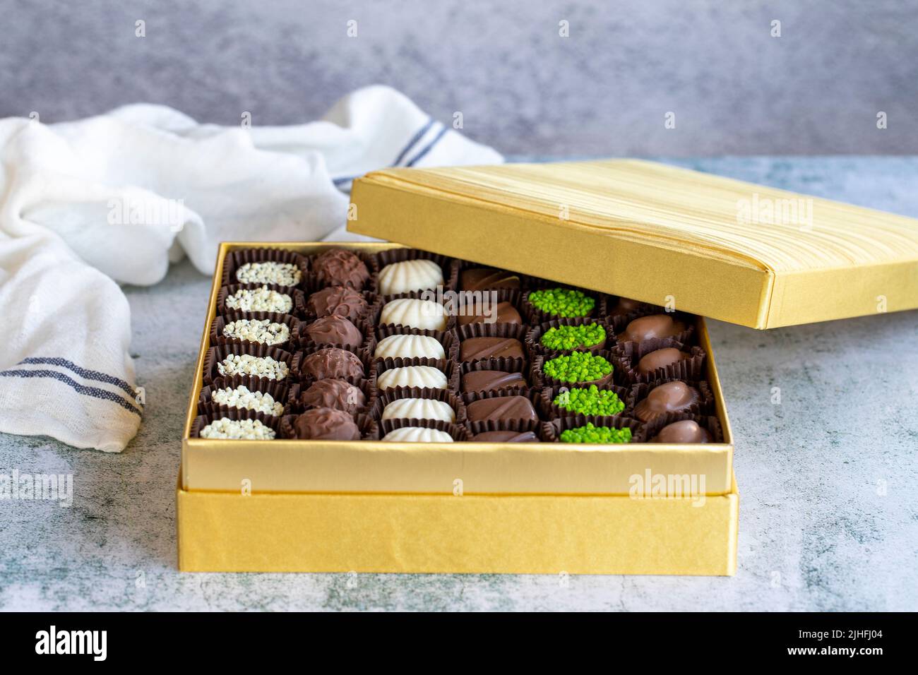 Special chocolate. Packed chocolate on stone background. Truffle ...