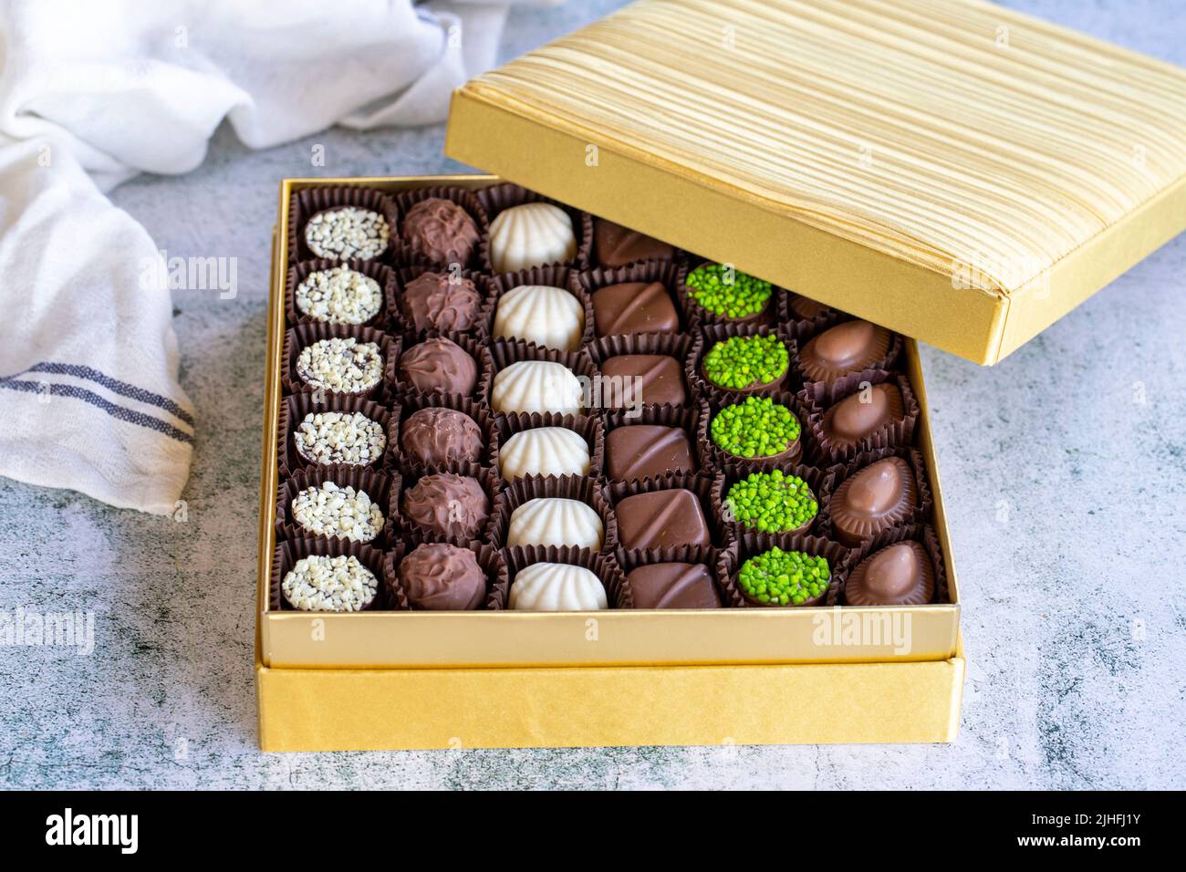 Special chocolate. Packed chocolate on stone background. Truffle ...