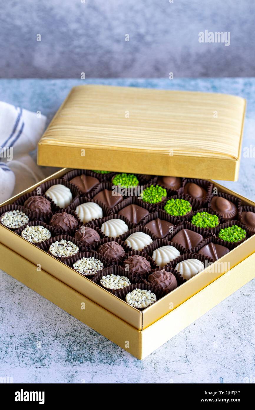 Special chocolate. Packed chocolate on stone background. Truffle ...