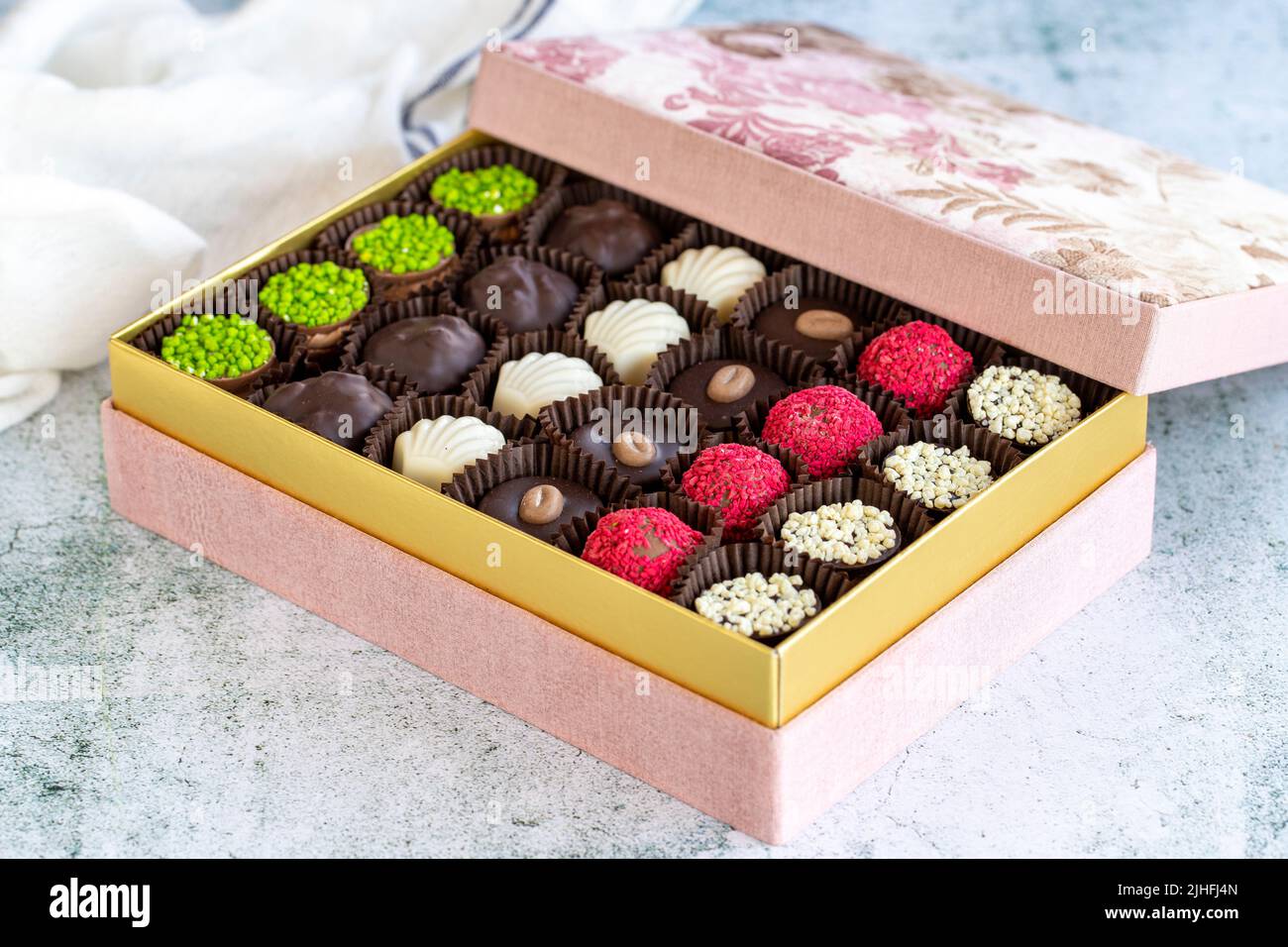 Special chocolate. Packed chocolate on stone background. Truffle ...