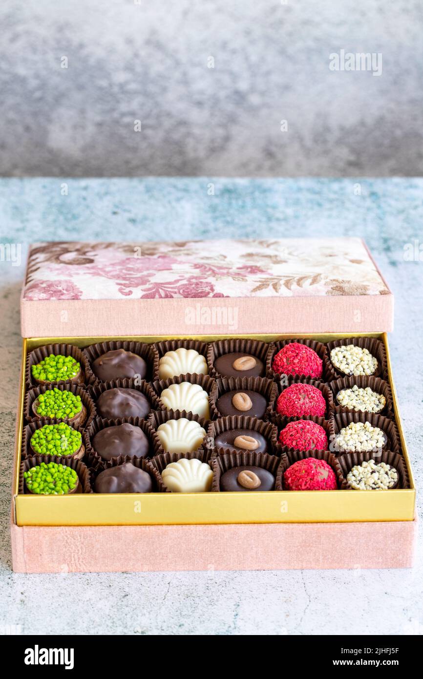 Special chocolate. Packed chocolate on stone background. Truffle ...