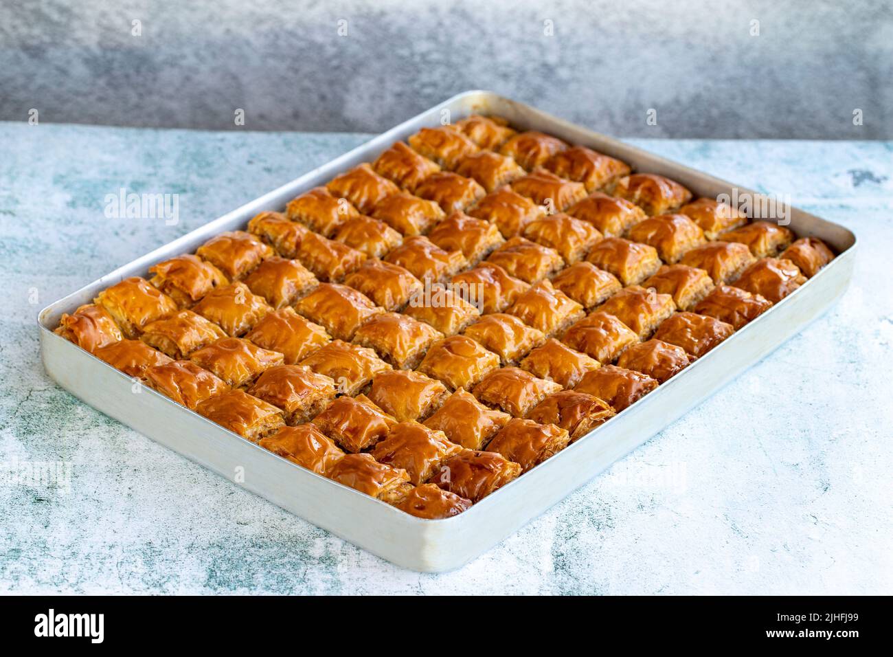 Walnut baklava. Tray baklava on stone background. Turkish cuisine ...