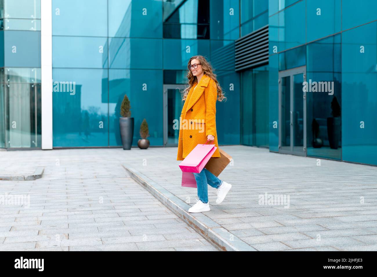 Business Woman With Shopping Bags Dressed Yellow Coat Walking Outdoors ...