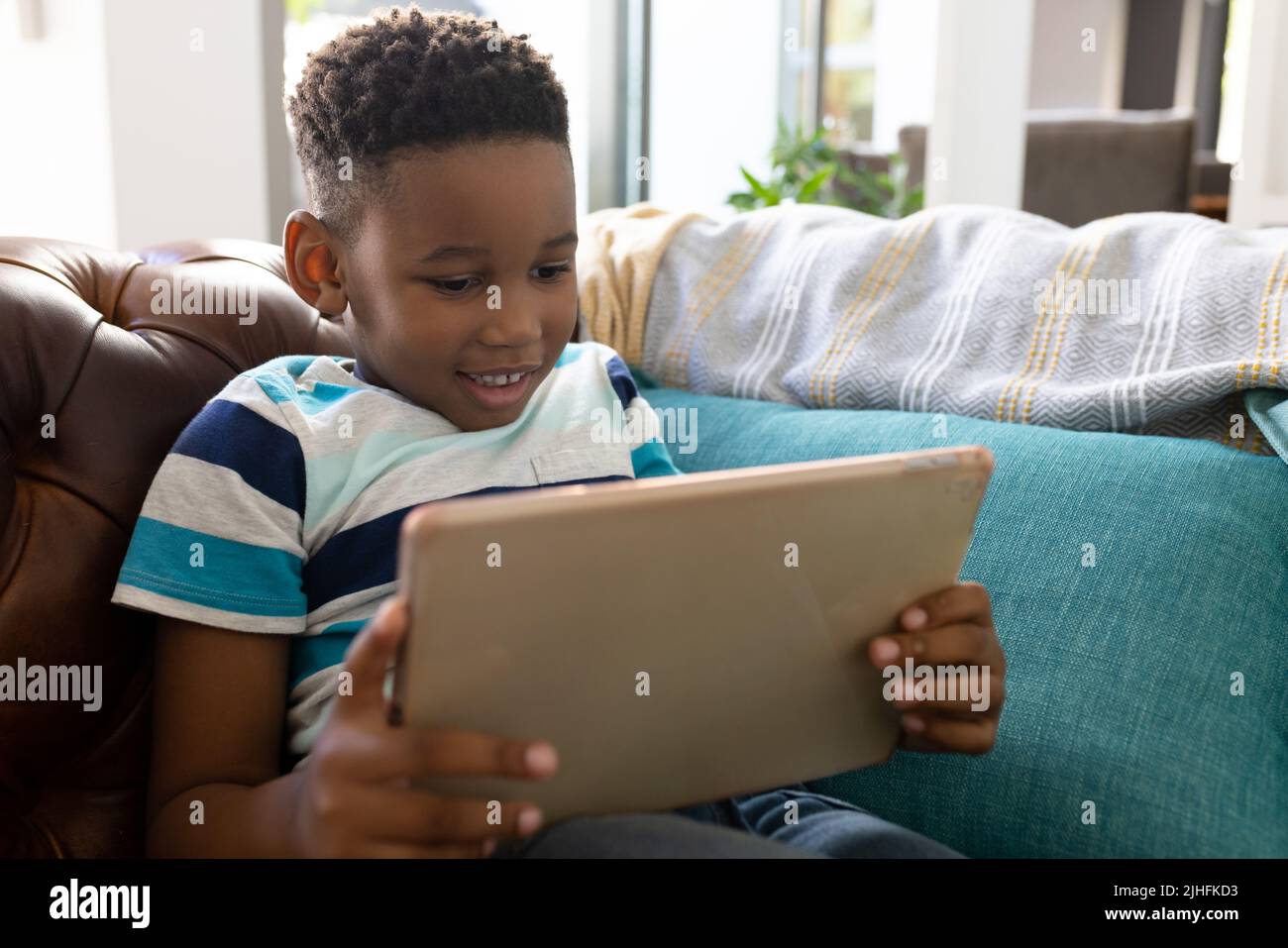 Image of african american boy using tablet Stock Photo - Alamy