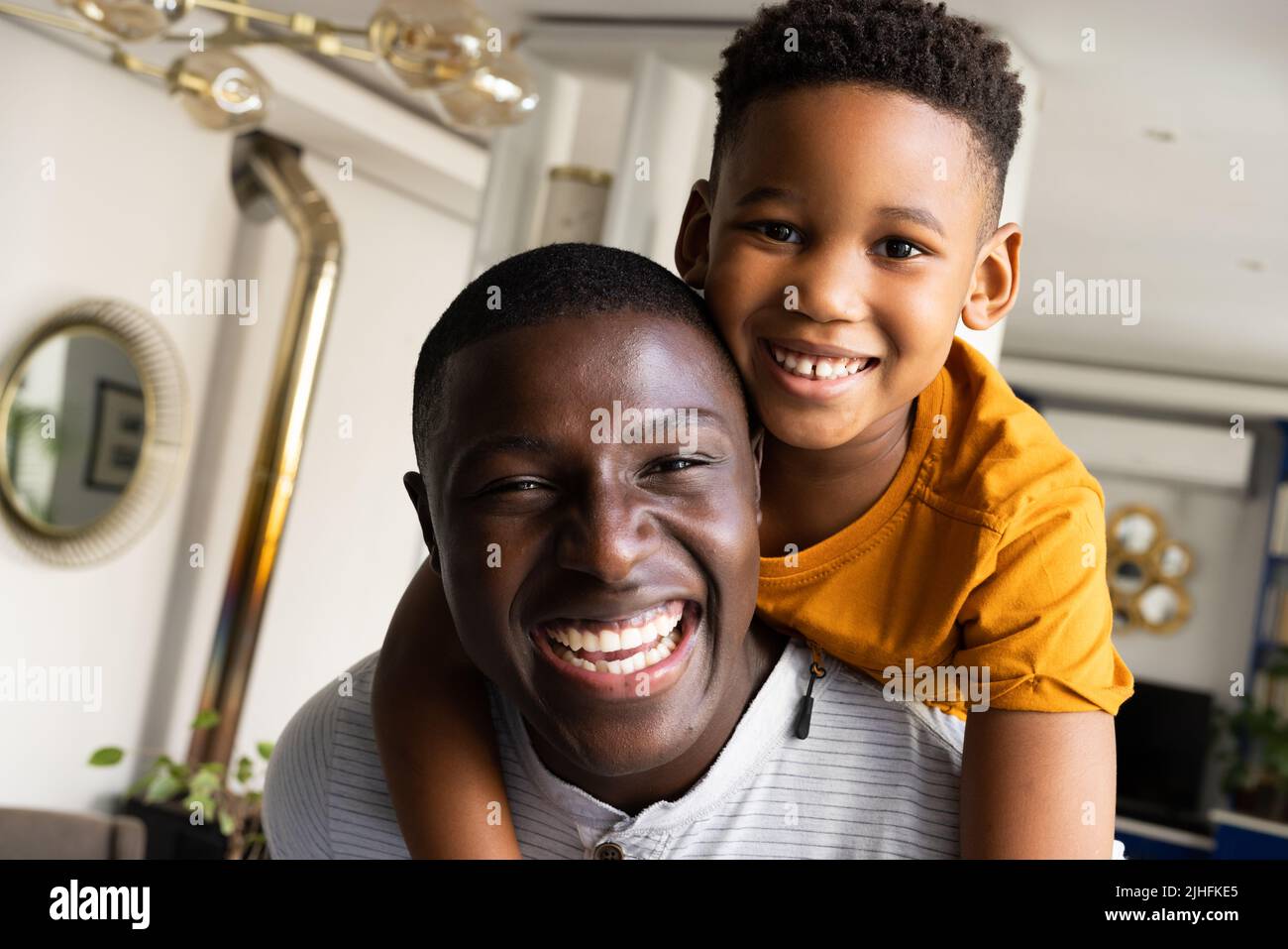 Portrait of smiling african american father and son Stock Photo - Alamy
