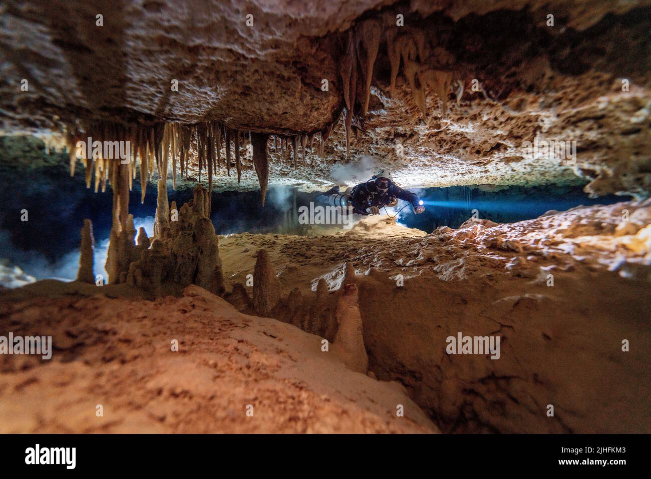Jagged stalactites line the cave. TULUM, MEXICO. These ethereal scenes ...