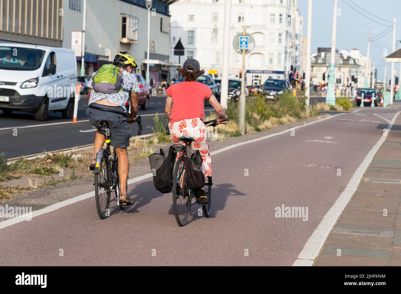 Old couple riding bike in Brighton promenade Stock Photo - Alamy