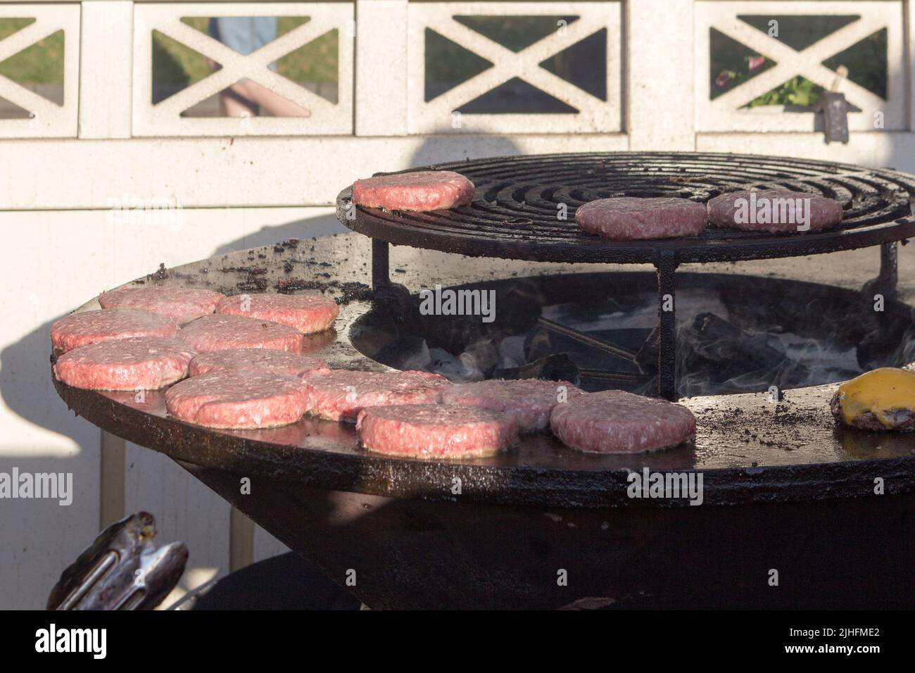 Cooking burgers on the grill. Close-up. Raw minced meat blanks are ...