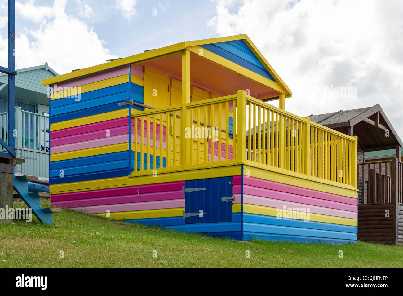 Brightly Coloured Beach Huts on Tankerton Beach, Kent, England Stock ...