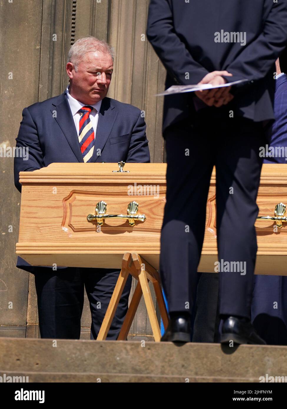 Former Rangers player Ally McCoist watches the casket arrive ahead of ...