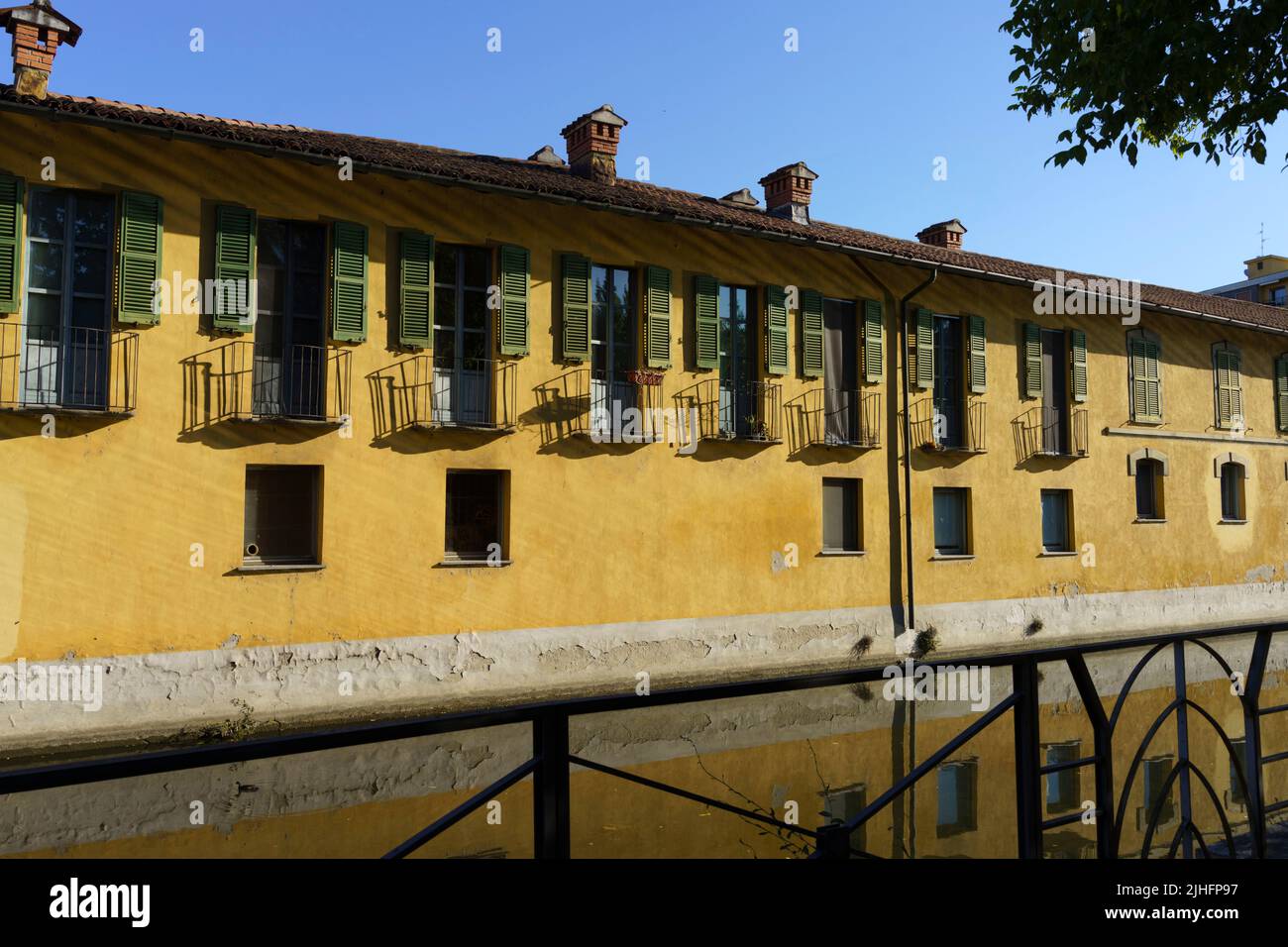 Old yellow building on the Martesana canal at Milan, Lombardy, Italy ...
