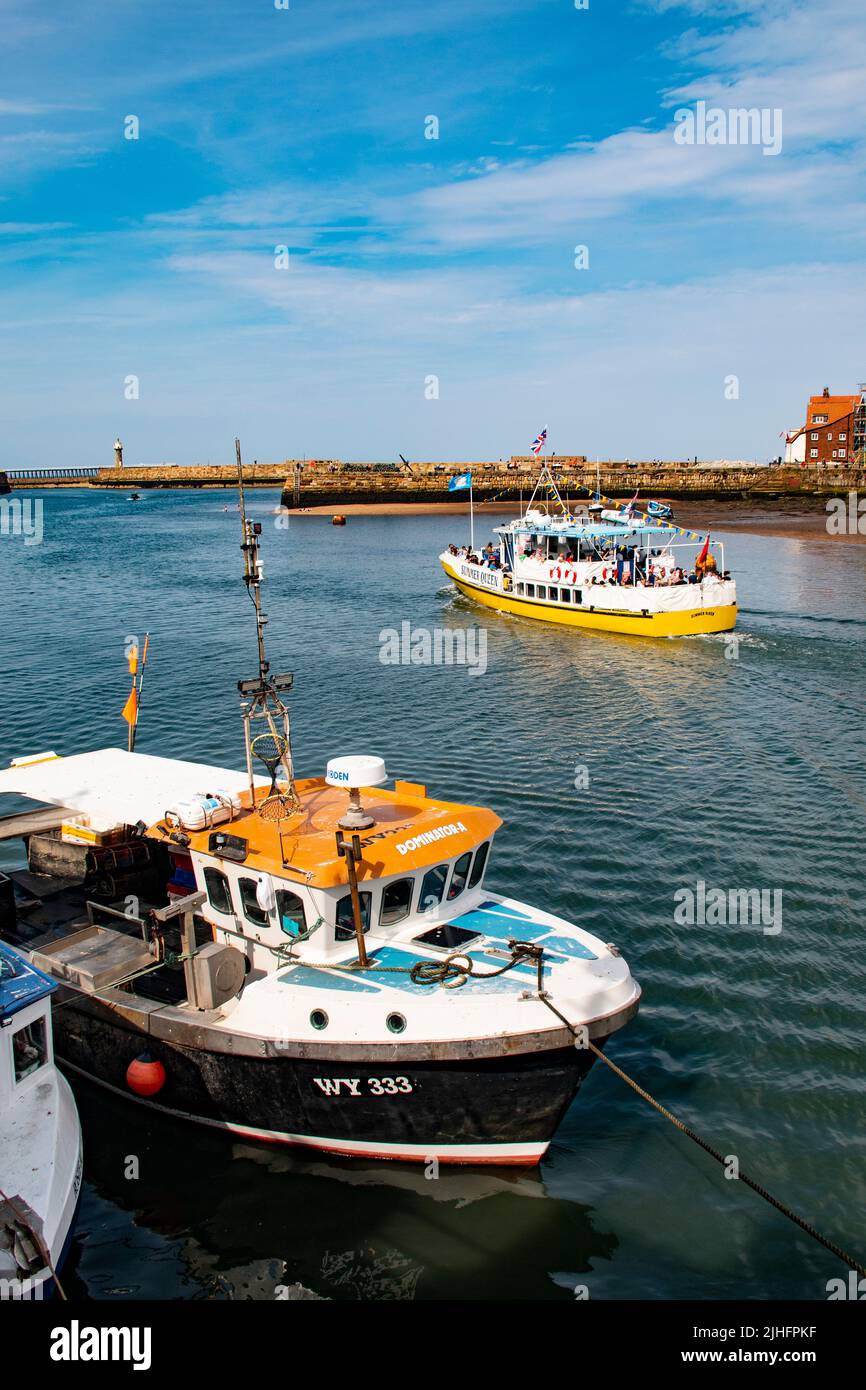 Whitby Harbour, River Esk, with tourist boats, Whitby, North Yorkshire ...