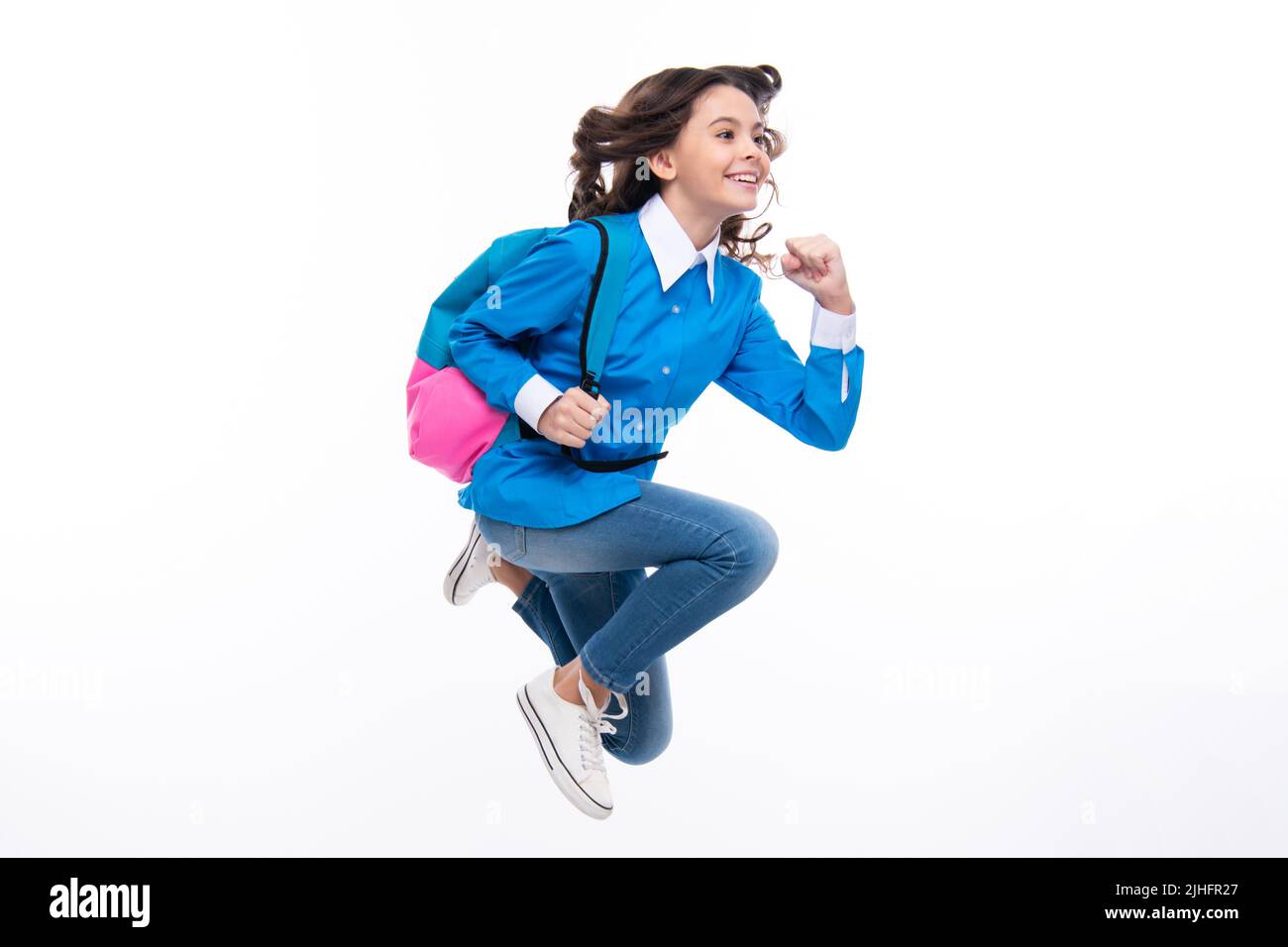 Back to school. Teenage school girl ready to learn. Run and jump ...