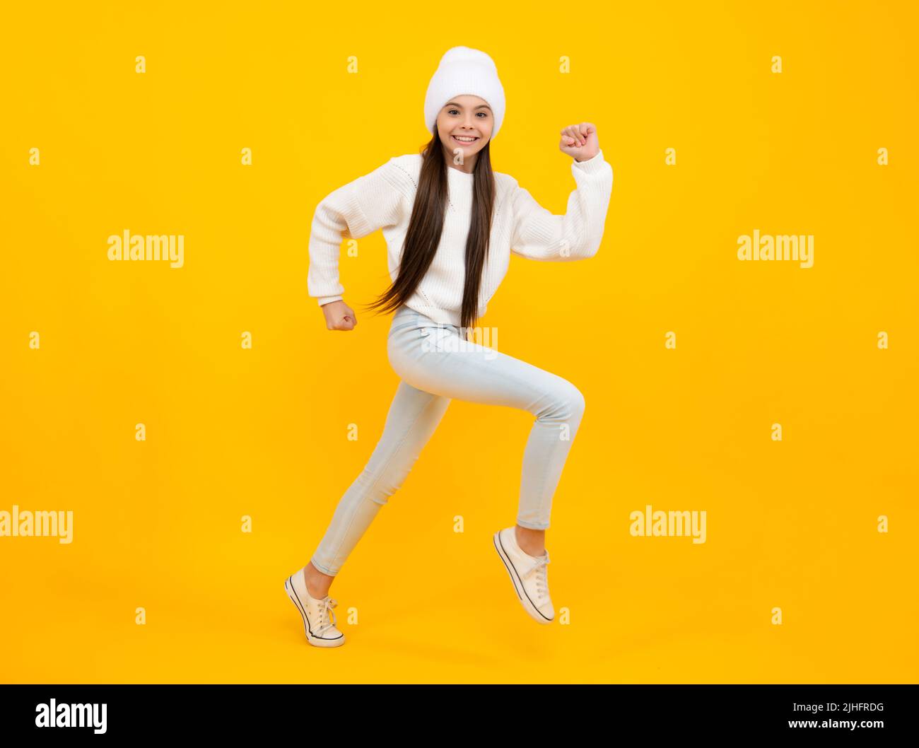 Happiness, freedom, motion and child. Young teenager girl jumping over ...