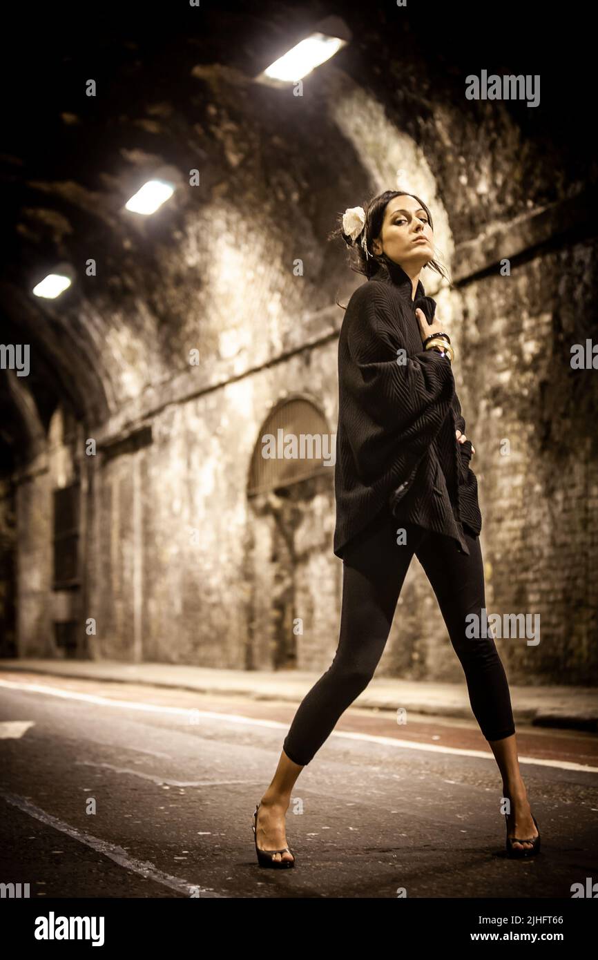 Urban Fashion. A beautiful young mixed race girl on location in a confident pose. From a series ...