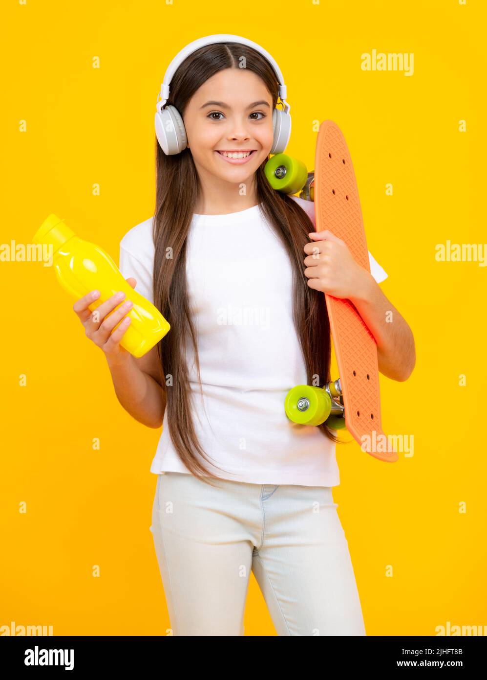 Happy teenager portrait. Studio shot of trendy teenage fashion model in ...