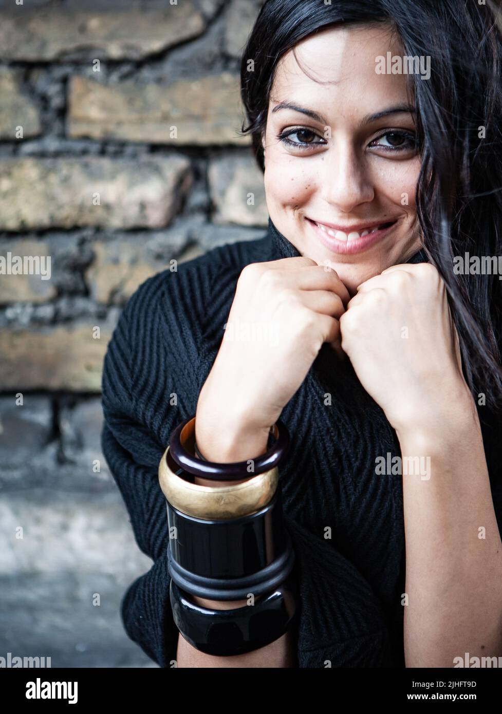 Urban Fashion. A beautiful young mixed race model in a relaxed mood ...