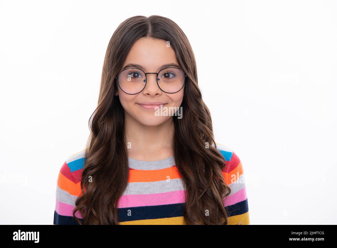 Portrait of beautiful happy smiling teenage girl on yellow studio ...