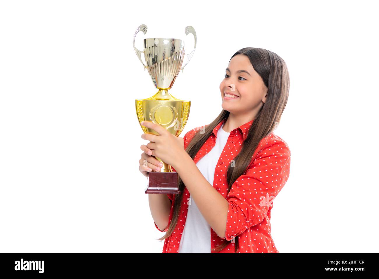 Teenage girl holding a trophy. Kid winner child won the competition ...