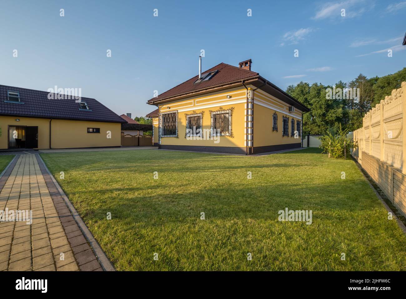 two-story concrete or brick country house Stock Photo - Alamy