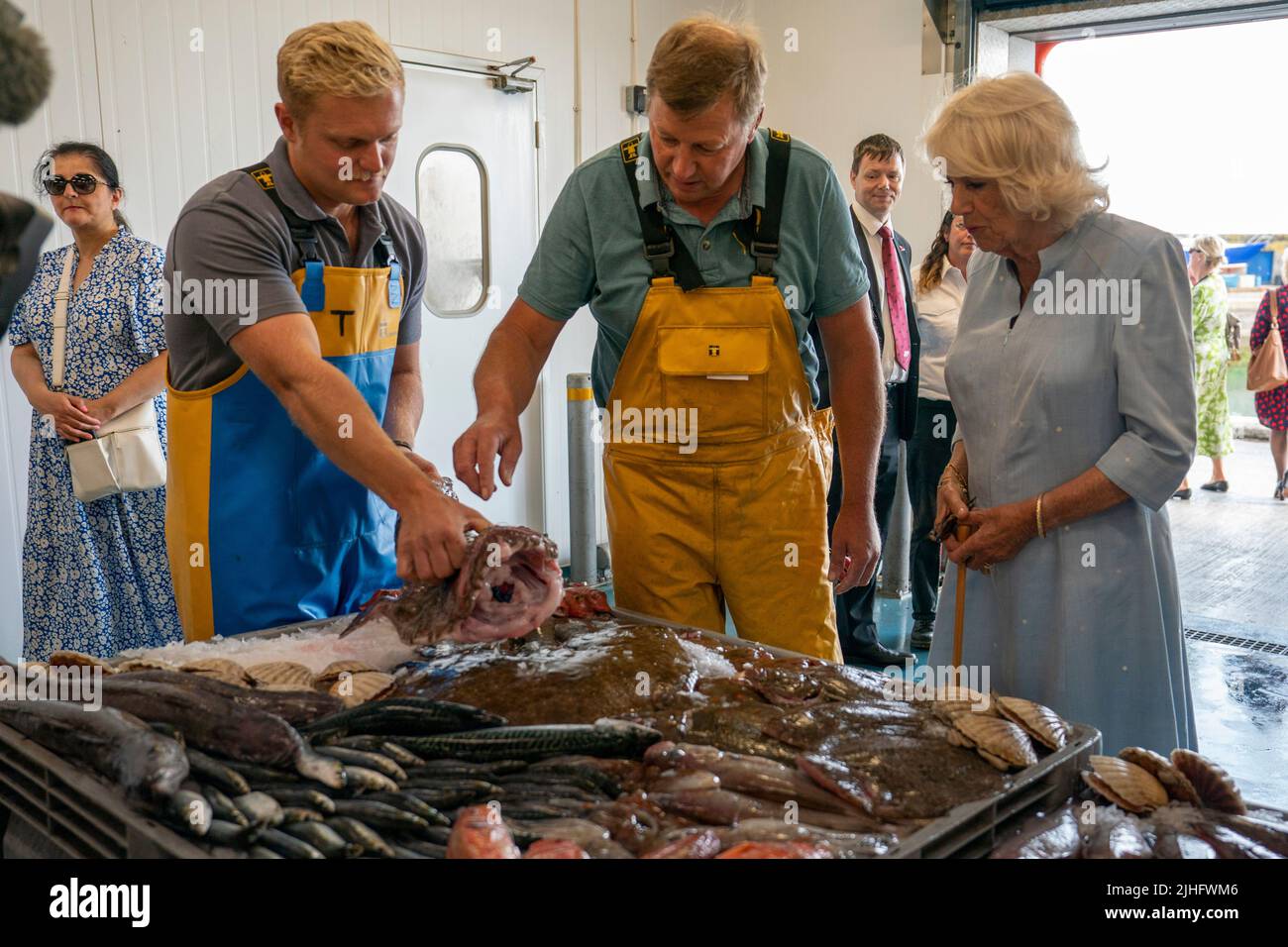 The Duchess of Cornwall talks to fishmongers during a visit to Newlyn ...