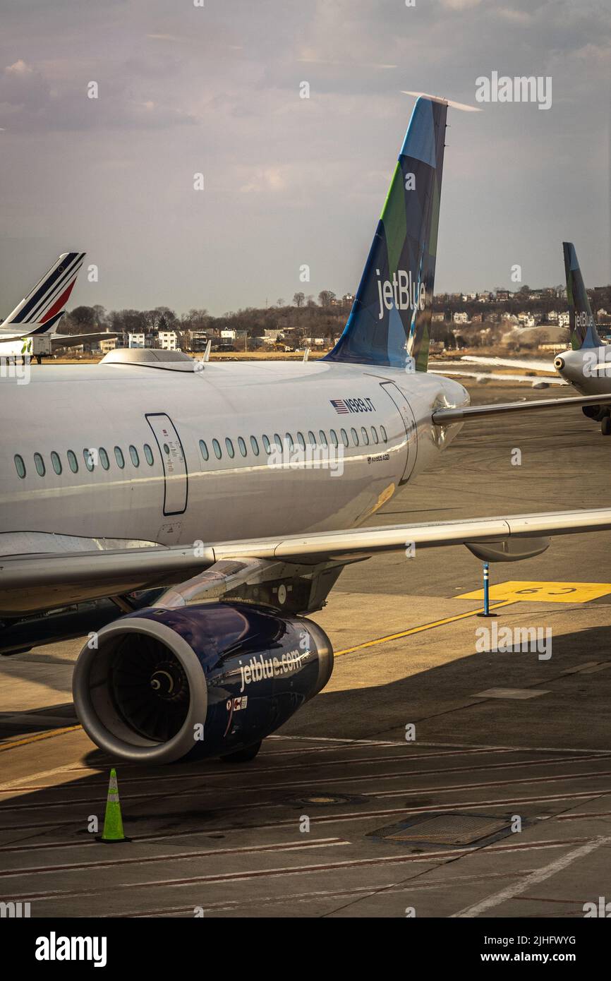 A vertical shot of the airplane's back part at an airport in the United ...