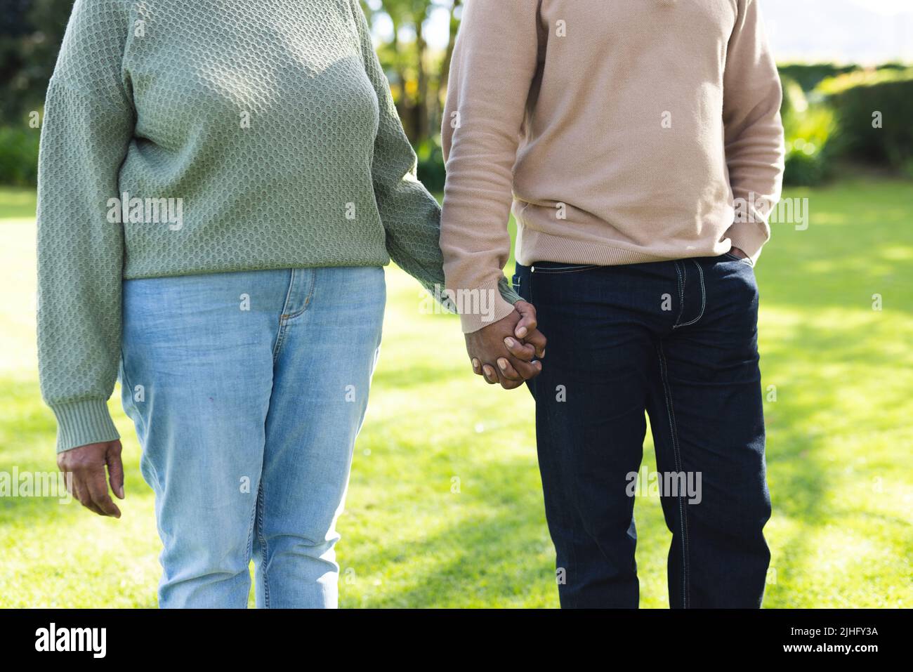 Image of midsection of african american senior couple in garden Stock ...