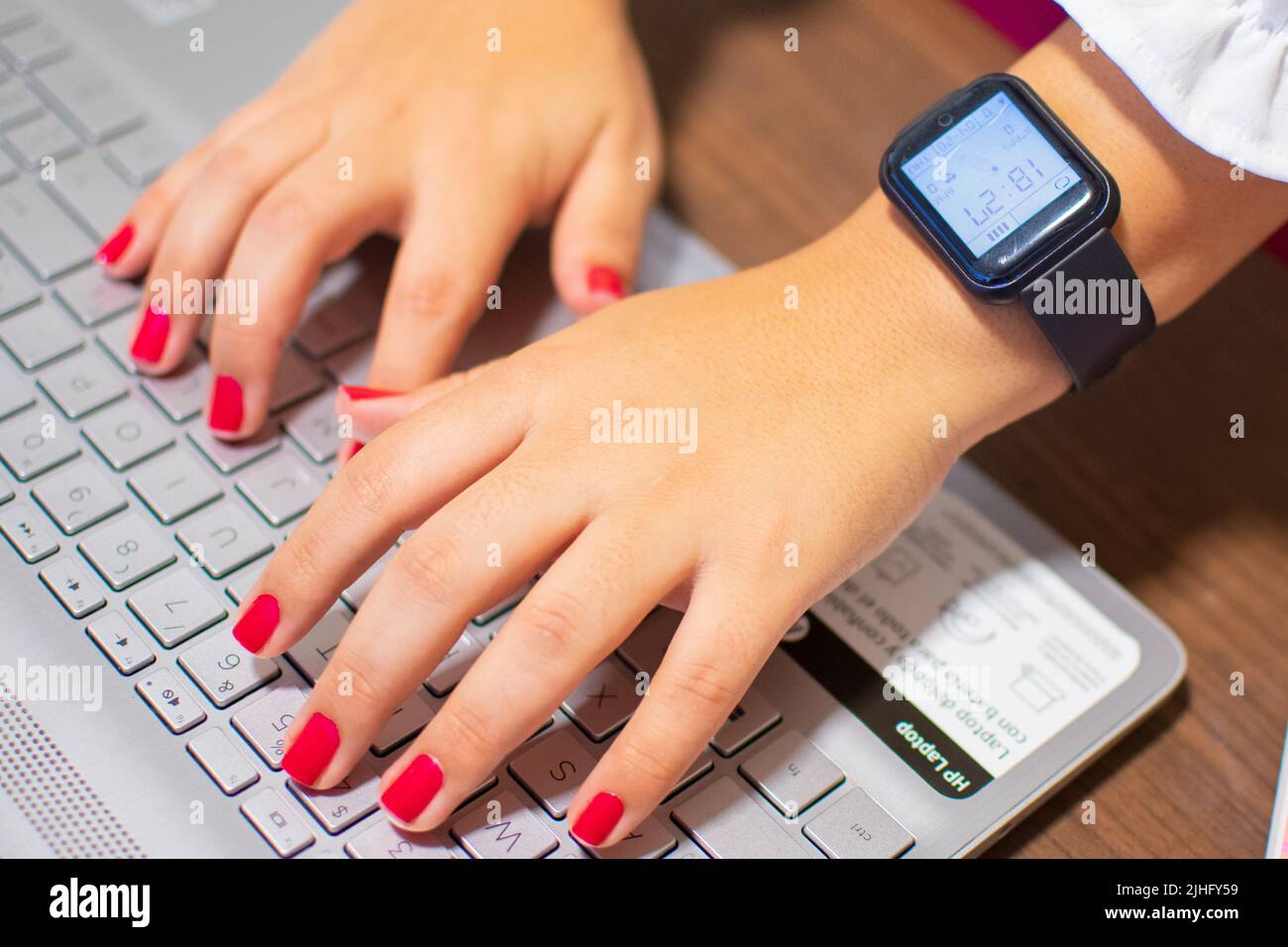 The close-up view of female hands typing on the keyboard Stock Photo ...