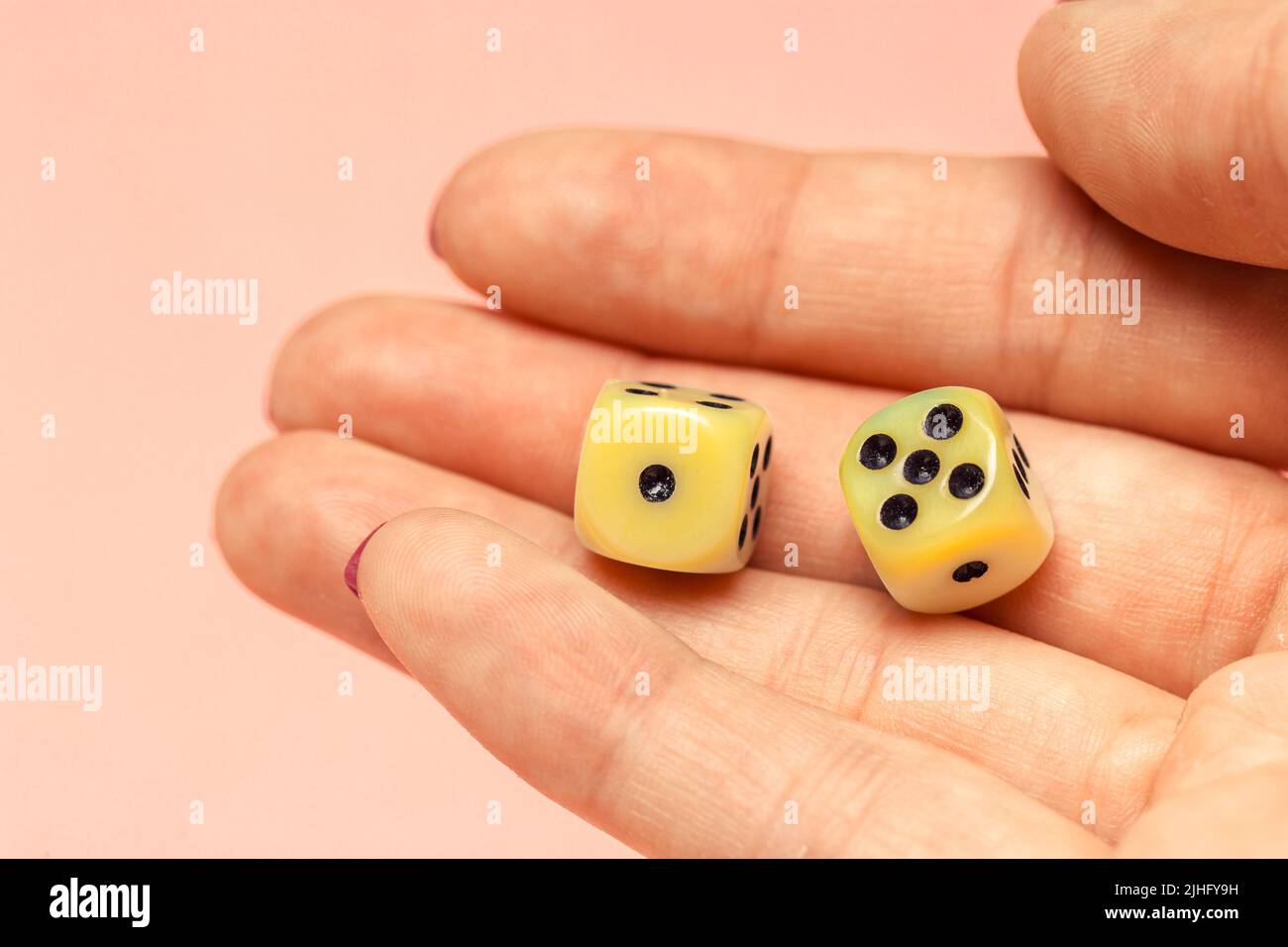 hand with a pair of dice Stock Photo - Alamy