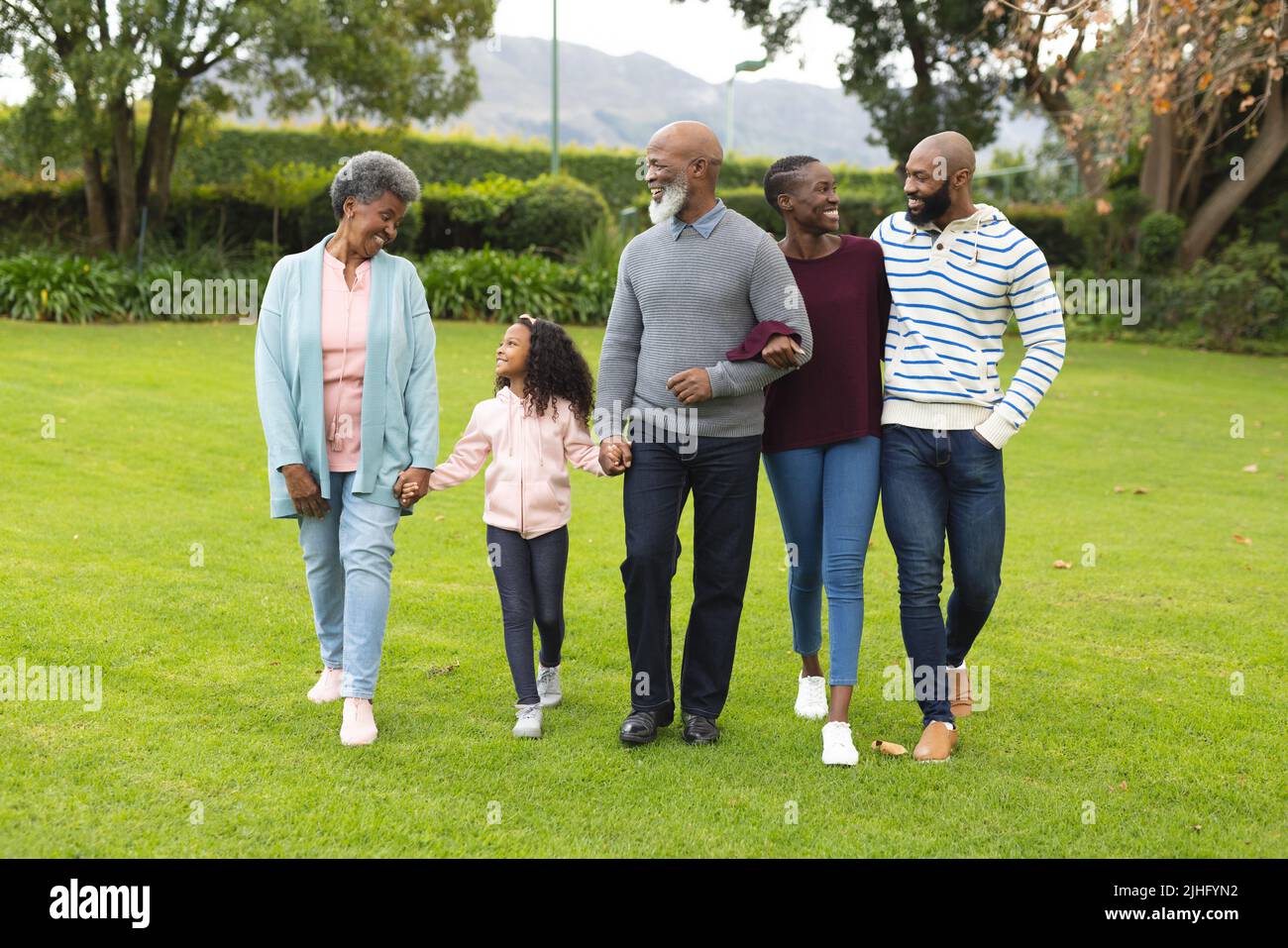 Image of happy multi generation african american family walking ...