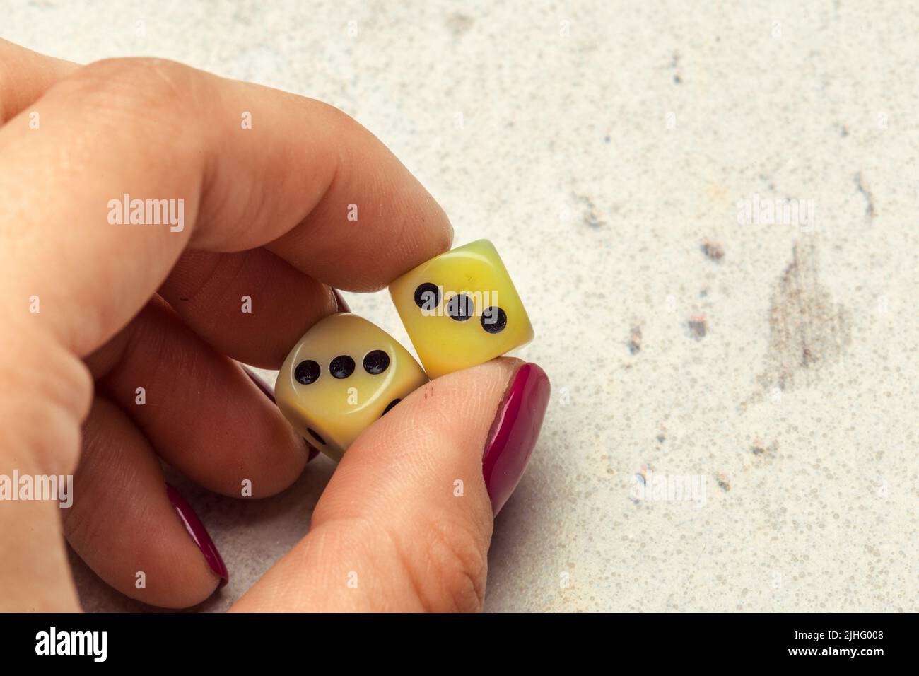 hand with a pair of dice Stock Photo - Alamy